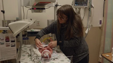 Changing Baby Stock Footage ~ Royalty Free Stock Videos | Pond5