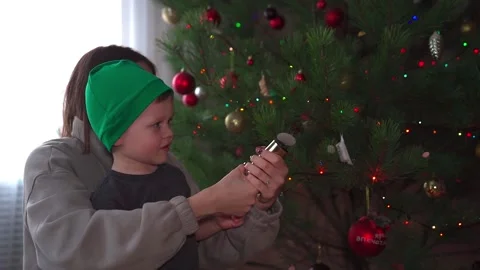 Mom Shows Child How to Blow Up a Clapper... | Stock Video | Pond5