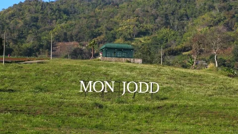 Mon Jodd sign on green field in theme pa... | Stock Video | Pond5