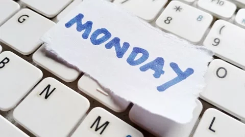 Monday memo written blue on piece of pap... | Stock Video | Pond5