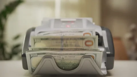 Money counting machine processing stacks... | Stock Video | Pond5