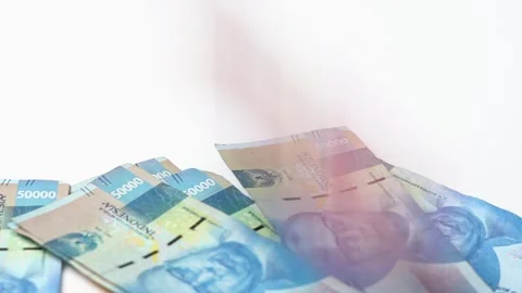 money falling from above. Rupiah currenc... | Stock Video | Pond5