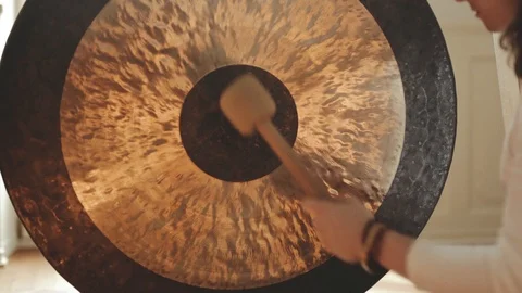 Monk hitting large Tibetan gong Sound He... | Stock Video | Pond5