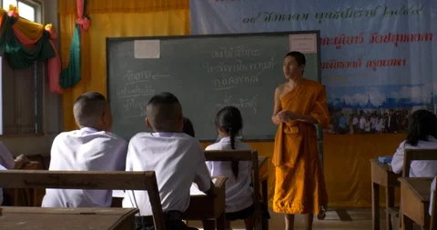 Monk teaching a classroom traditional Th... | Stock Video | Pond5