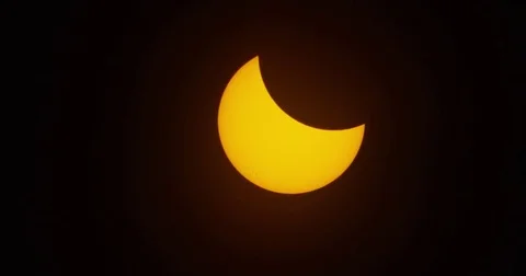 Moon moving across the sun during the so... | Stock Video | Pond5