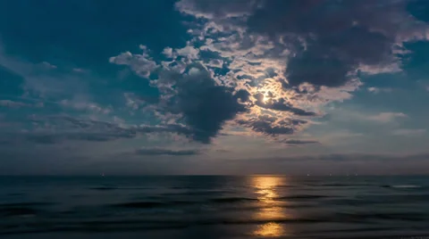 moon over ocean night timelapse cloudy s... | Stock Video | Pond5