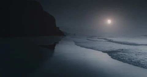 Moonlight ocean waves wash sand beach. A... | Stock Video | Pond5