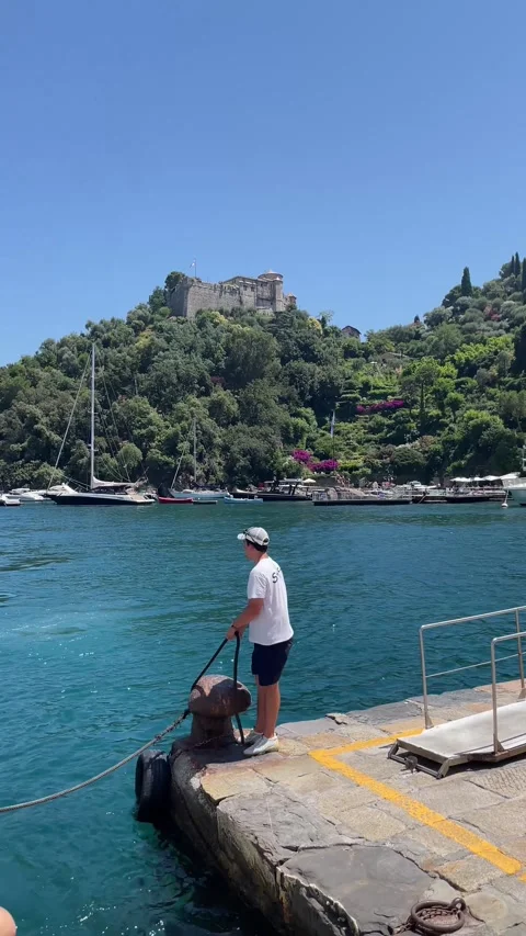 Mooring man securing the boat to the doc... | Stock Video | Pond5