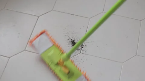 A mop with a bright orange rag removes s... | Stock Video | Pond5