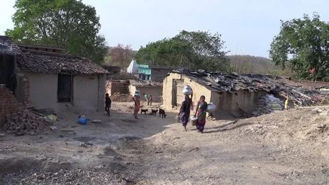 Morning in poor Indian village. Women ca... | Stock Video | Pond5
