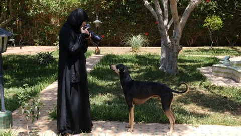 Moroccan Arab Muslim woman with a DSLR c... | Stock Video | Pond5