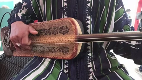 Moroccan musician playing the sintir | Stock Video | Pond5
