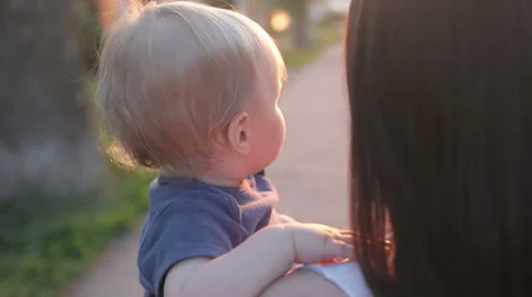 Mother and baby playing outside in summe... | Stock Video | Pond5
