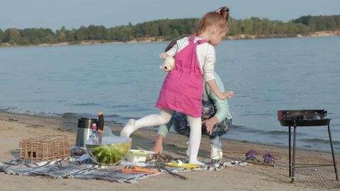 Mother and daughter fry meat and vegetab... | Stock Video | Pond5