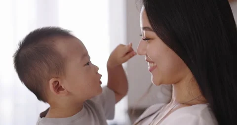 Mother and son face to face. Chinese, Ja... | Stock Video | Pond5