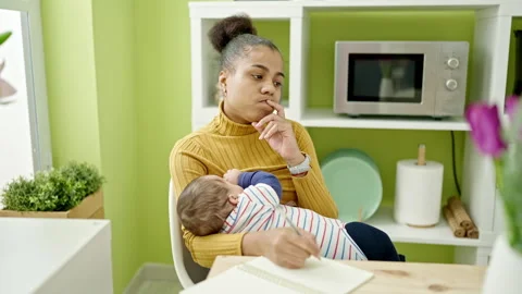Mother and son writing notes while breas... | Stock Video | Pond5