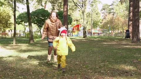 mother catches up with the child. Little... | Stock Video | Pond5