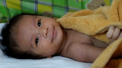 Mother changing baby boy | Stock Video | Pond5