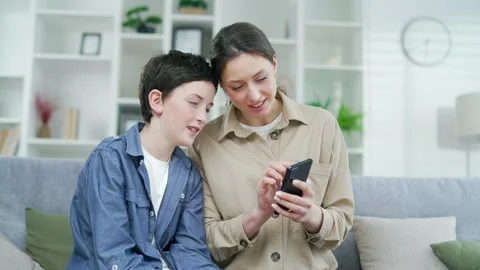 Mother with a child, a teenage son, use ... | Stock Video | Pond5