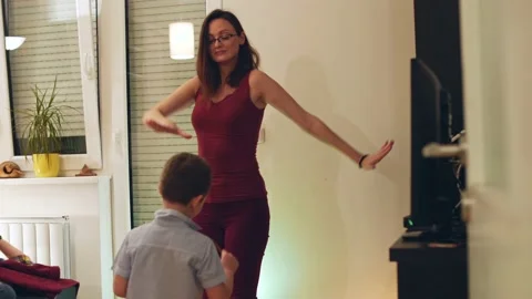 Mother learning her son how to dance | Stock Video | Pond5