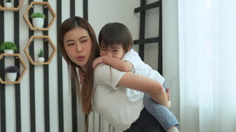 Mother lulling a lovely son while giving... | Stock Video | Pond5