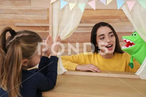 Mother performing puppet show for her daughter at home ~ Premium Photo ...