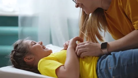 mother tickle daughter. happy family a p... | Stock Video | Pond5