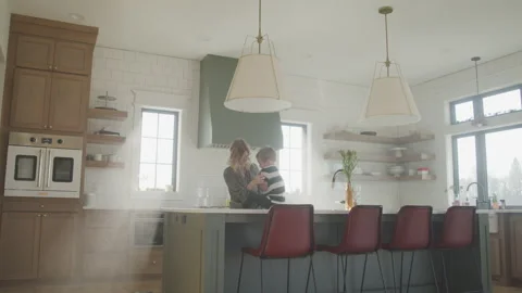 Mother Tickling Son In Kitchen | Stock Video | Pond5
