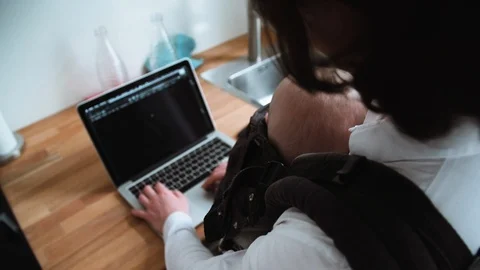 Mother Typing on Laptop Keyboard with In... | Stock Video | Pond5