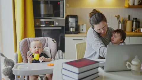 mother working from home remotely with b... | Stock Video | Pond5