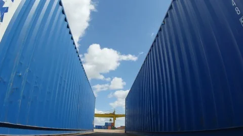 Motion between Blue Big Containers in Bl... | Stock Video | Pond5
