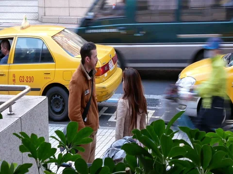 Motion of couple talking at sidewalk whi... | Stock Video | Pond5