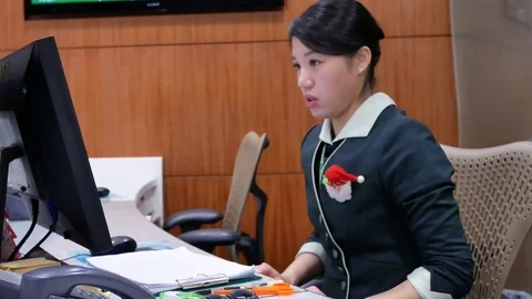 Motion of Eva airline receptionist deali... | Stock Video | Pond5