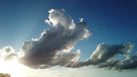 Motion lapse - sun rays extend from the ... | Stock Video | Pond5