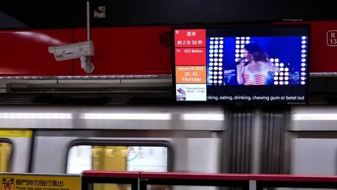 Motion of MRT passing by platform at nig... | Stock Video | Pond5