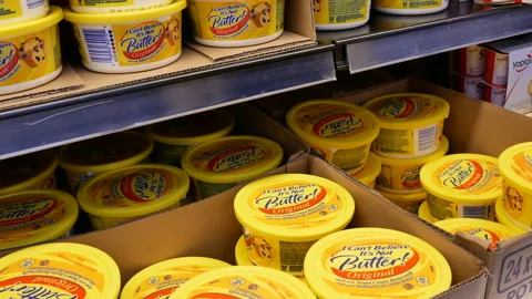 Motion of people buying butter at fridge... | Stock Video | Pond5