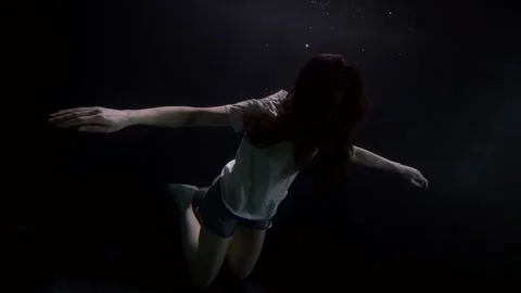 motionless body of adult woman is floati... | Stock Video | Pond5