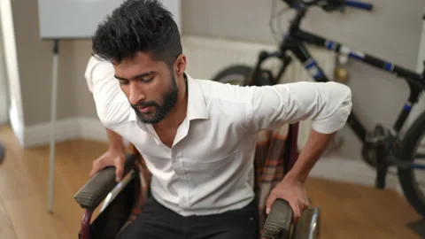 Motivated young man trying to stand up f... | Stock Video | Pond5