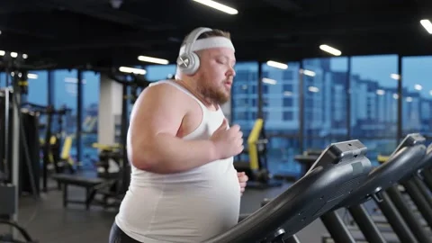 Motivation, overweight man run on a trea... | Stock Video | Pond5