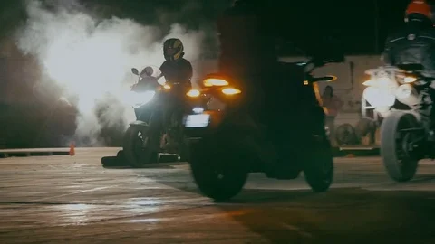 MOTO BIKERS RUNNING THROUGH OBSTACLES | Stock Video | Pond5