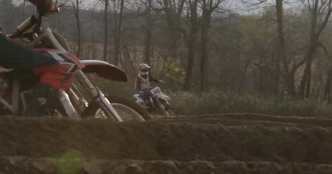 Motocross racing on dirty track two ride... | Stock Video | Pond5