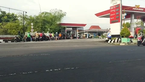 Motorbikes Queue at Pertamina Gas Statio... | Stock Video | Pond5