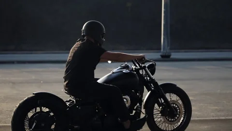 Motorcycle in profile. A man in a protec... | Stock Video | Pond5