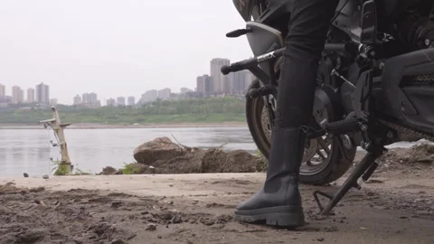 Motorcycle rider opens the motorcycle's ... | Stock Video | Pond5