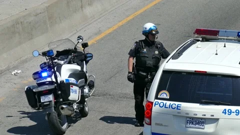 Motorcyclist police officer chatting | Stock Video | Pond5