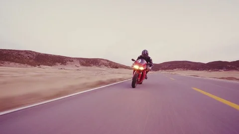 Motorcyclist racing his motorcycle down ... | Stock Video | Pond5