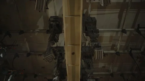 Motorized lighting fixtures hang from th... | Stock Video | Pond5