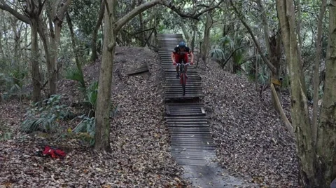 Mountain Bike Wooden Ramp Down Front on ... | Stock Video | Pond5