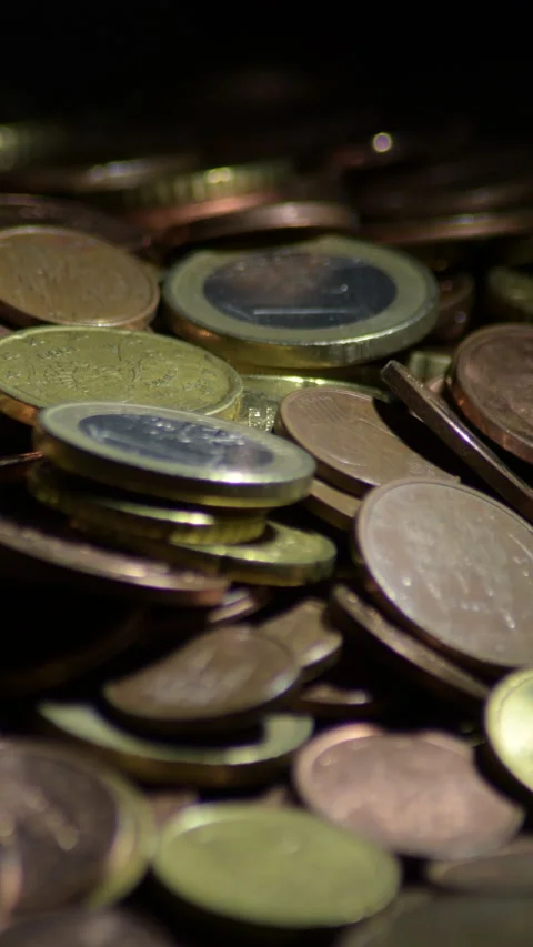 Mountain of Euro coins turning, Vertical... | Stock Video | Pond5
