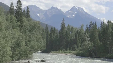 Mountain River (Zoomed In) with Peaks in... | Stock Video | Pond5